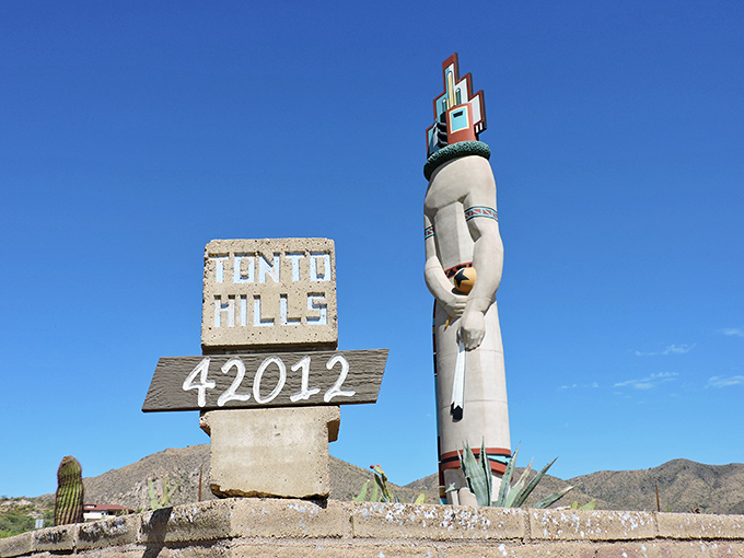 The Tonto Hills zip code marker stands beside its most famous resident, a landmark visible for miles around.
