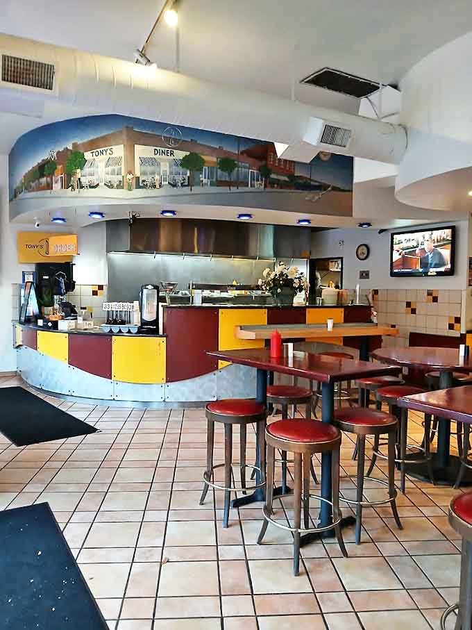 The dining room's cheerful yellow accents and open kitchen design let you watch the breakfast magic happen in real time.