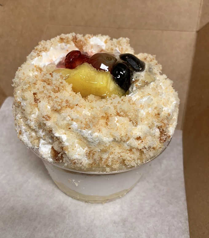 Tres leches cake topped with fresh fruit and whipped cream, because sometimes you need three kinds of milk soaking into your dessert for maximum happiness.