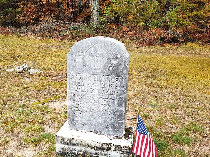 Weathered but legible, this upright headstone bears silent witness to the passage of over 120 Michigan winters.
