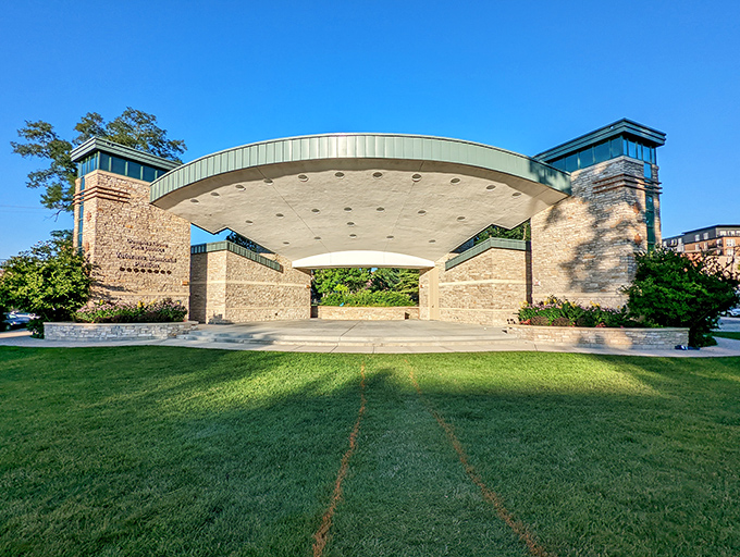 The Veterans Memorial Pavilion stands as an architectural focal point, its distinctive curved roof providing shelter for community gatherings year-round.