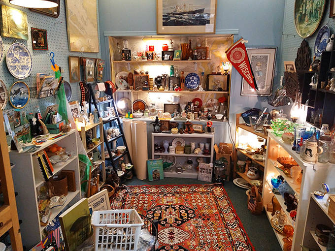 Antique portraits gaze down at collections of glassware and linens, creating the feeling you're browsing through someone's beloved family estate rather than a store.