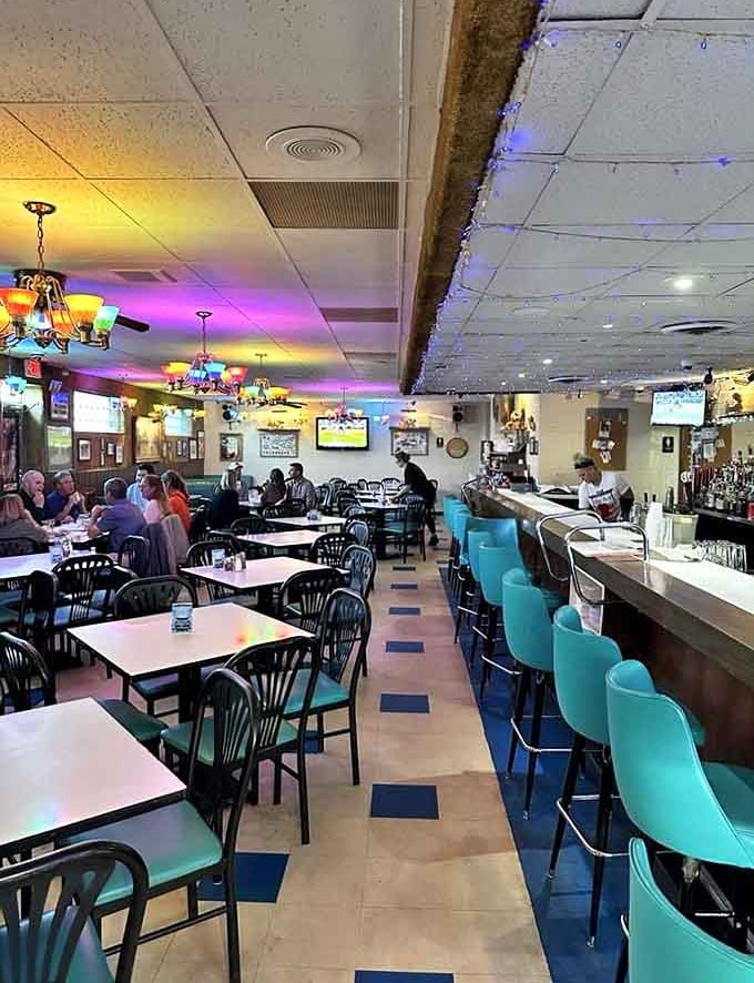 The dining room buzzes with conversation as regulars and newcomers gather under colorful lights to share Chicago's best-kept pizza secret.