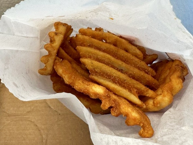 Waffle fries that achieve the golden ratio of crispy exterior to fluffy interior &ndash; potato perfection in every bite.