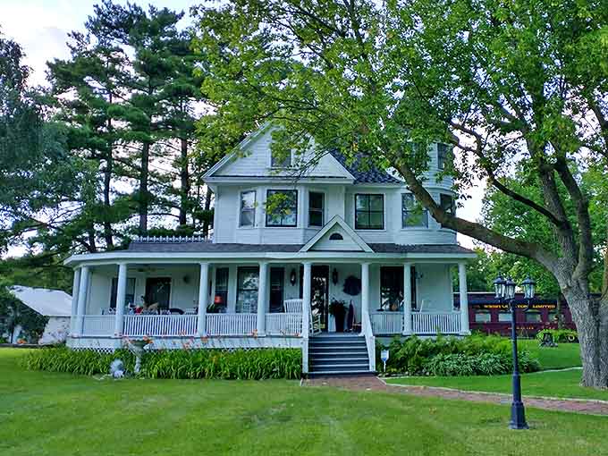The main house offers traditional charm with its wraparound porch and classic white clapboard &ndash; Norman Rockwell would approve.