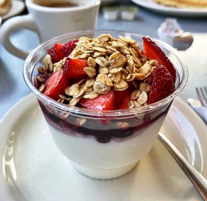 Fresh berries and crunchy granola transform simple yogurt into a morning masterpiece – proof that healthy can still be indulgent.