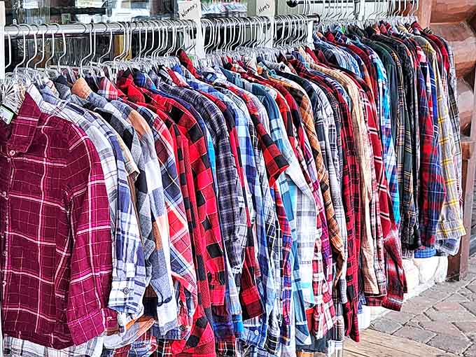 Flannel shirts hang like a Minnesota uniform collection, offering warmth, style, and that perfect broken-in comfort only pre-loved clothing provides.