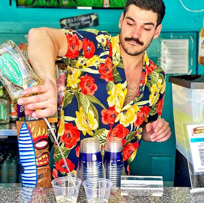 Skilled mixologists craft tropical concoctions with theatrical flair, turning drink service into an entertainment experience all its own.