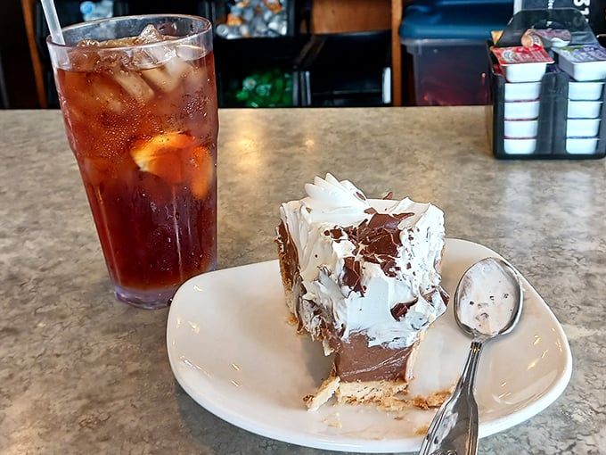 Sweet meets refreshing &ndash; a tall glass of iced tea alongside chocolate cream pie that's worth every calorie and possibly a few extra miles of walking.