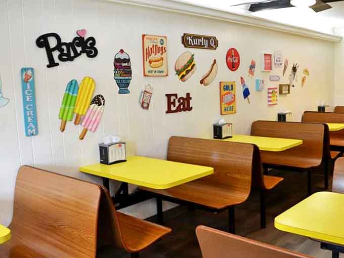 Vintage signs and bright yellow tables create the perfect backdrop for devouring ice cream without judgment or regret.