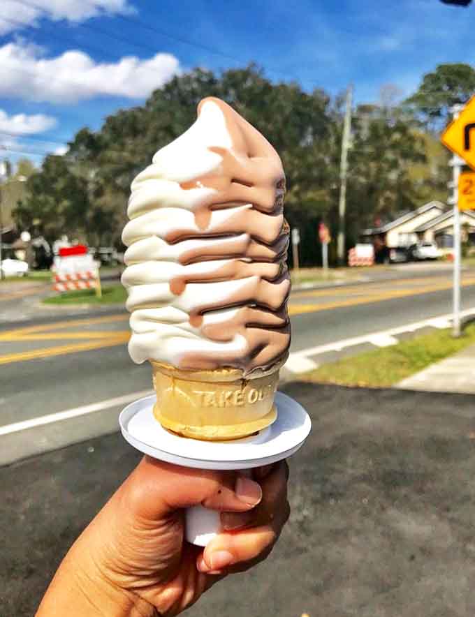 Defying gravity and common sense, this perfectly swirled soft-serve stands tall like a dairy Leaning Tower of Pisa that somehow never falls.