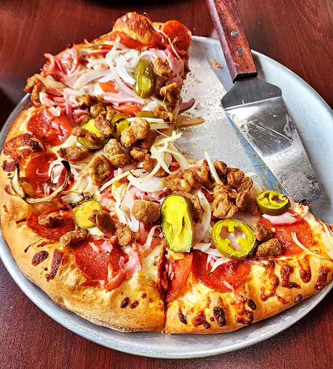 Fully loaded pizza: A carnival of toppings! Pepperoni, sausage, and jalape&ntilde;os create a flavor party where everyone's invited and nobody leaves hungry.