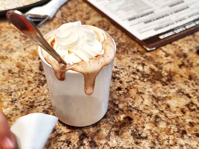 Winter in a mug &ndash; topped with a cloud of real whipped cream slowly melting into chocolate below, creating a warm hug for your insides.