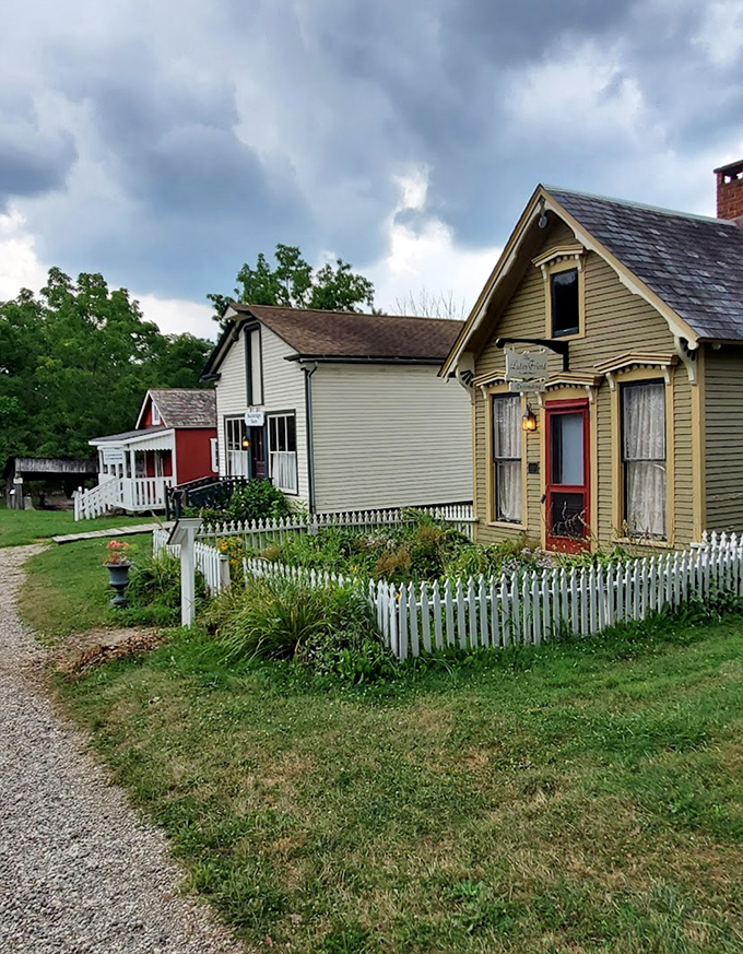 Charming period homes with white picket fences create a picture-perfect neighborhood frozen delightfully in the 19th century.