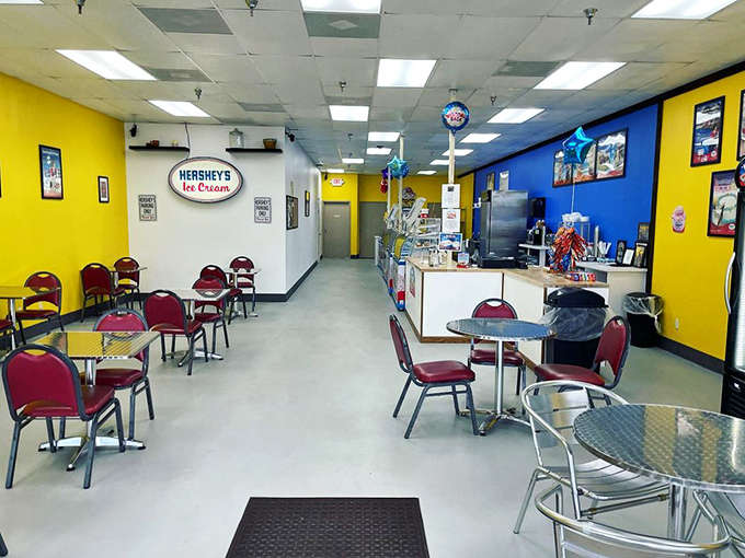 The serving counter gleams with possibility, where friendly staff members stand ready to guide you through flavor choices that might just change your afternoon.