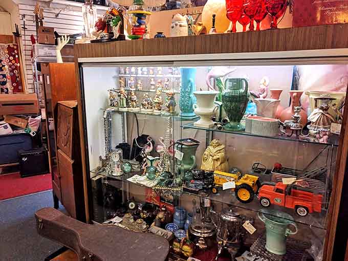 Glass display cases showcase an eclectic mix of treasures, from ornate vases to quirky figurines, each item carefully positioned to catch the light.