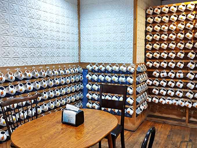 Mug wall: A ceramic mosaic of personality – each mug tells a story, waiting for its regular customer to return for another chapter.
