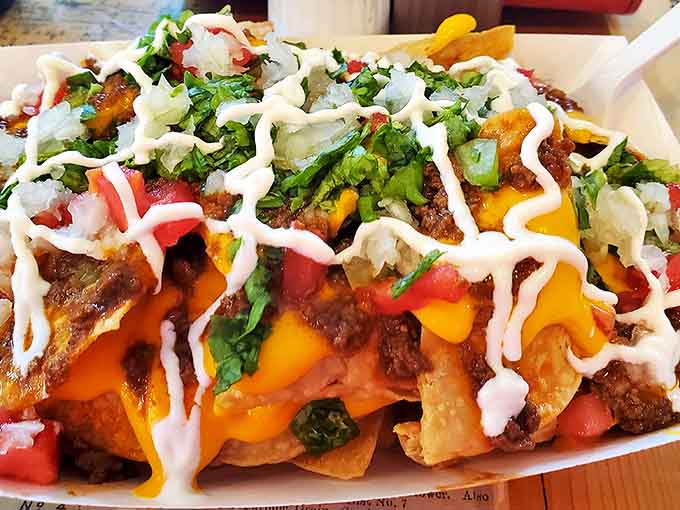 Loaded nachos that require a game plan before eating &ndash; crispy chips supporting a mountain of toppings that somehow manages to stay delicious down to the last bite.