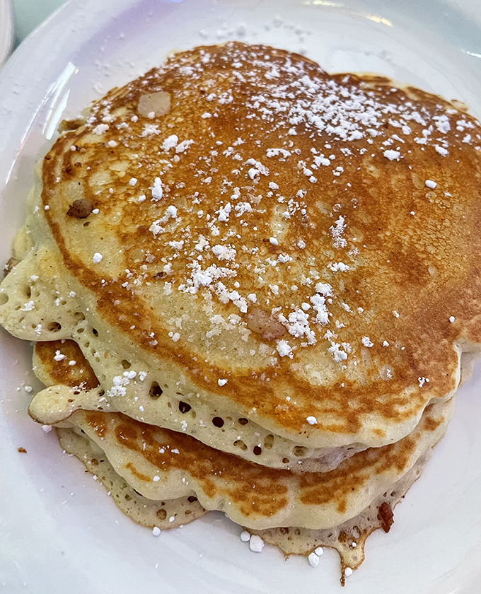These aren't just pancakes&mdash;they're fluffy golden discs of happiness dusted with powdered sugar. Maple syrup not pictured but absolutely mandatory.