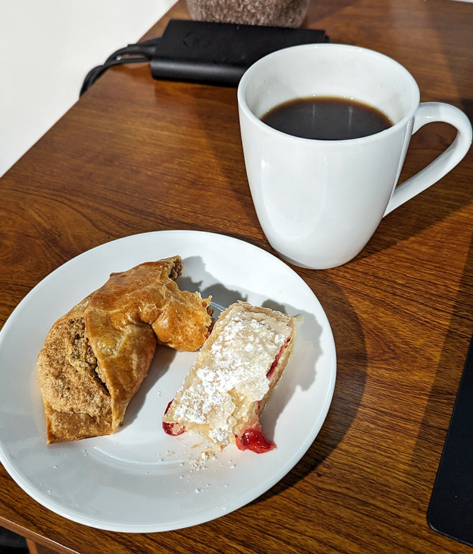 A perfect pairing: strong coffee alongside delicate pastry creates that rare moment when the world fades away and only flavor matters.