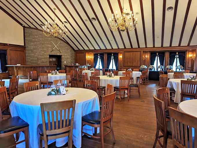 The reception hall transforms for celebrations of all kinds, with tables arranged beneath wooden beams and chandeliers for truly memorable gatherings.