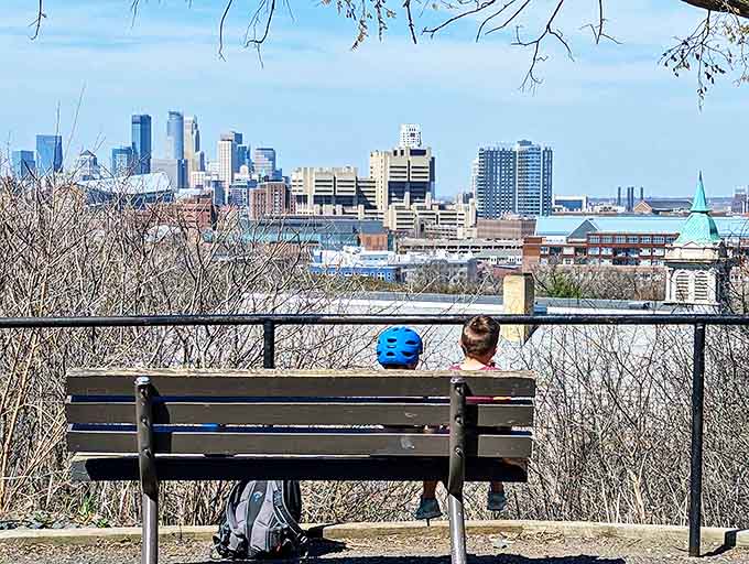 Morning light bathes the tower in a gentle glow, creating the perfect backdrop for contemplation on a park bench.