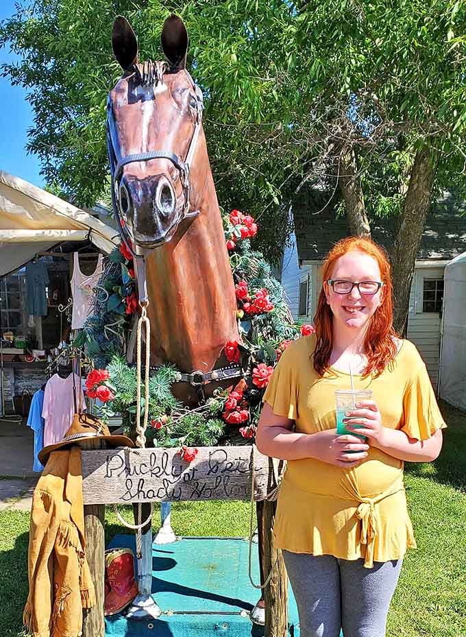 A life-sized horse statue becomes the perfect photo opportunity, where shoppers pause between discoveries to document their flea market adventures.