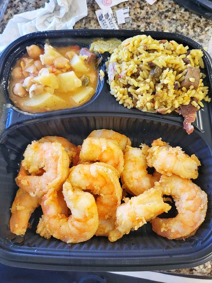 Golden fried shrimp with yellow rice and soup, because sometimes you need the full seafood experience.