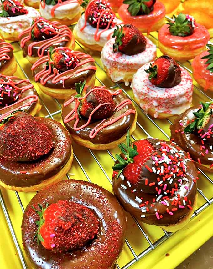 These strawberry-topped donuts aren't just breakfast, they're edible art &ndash; each berry perched atop swirls of frosting like tiny sweet crowns.