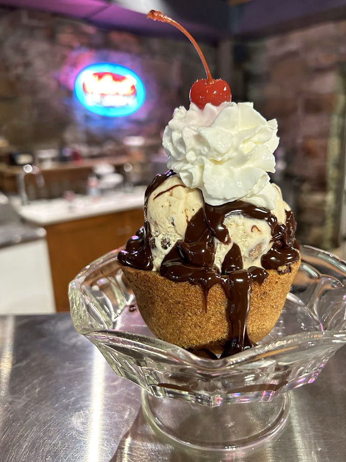 A classic sundae served in glass that lets you watch the hot fudge perform its magical disappearing act into creamy vanilla depths.