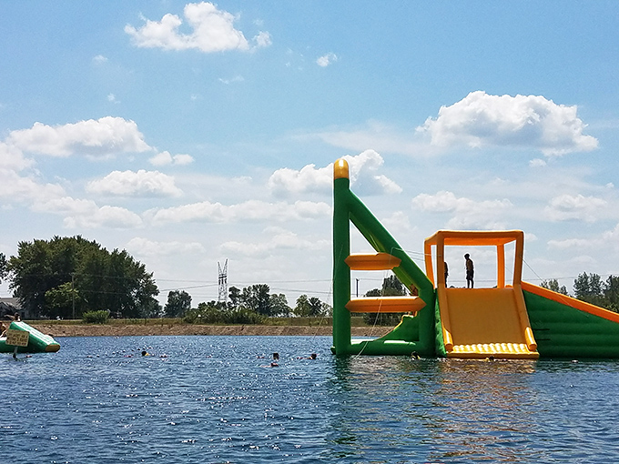 Aquatic adventurers tackle the towering inflatable slide &ndash; that moment of hesitation before gravity takes over is priceless!