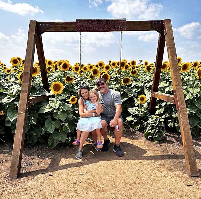 The rustic wooden swing frame offers the perfect photo opportunity, framing families against a backdrop that Mother Nature herself designed.