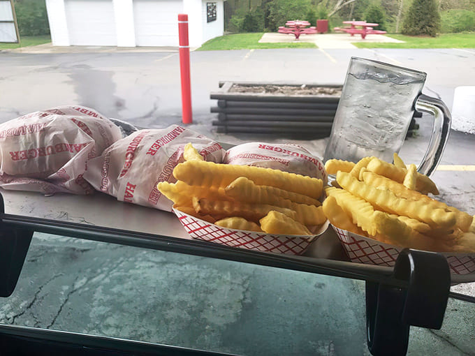 Car dining at its finest – burgers, fries and cold drinks delivered right to your window, transforming your vehicle into the best seat in the house.