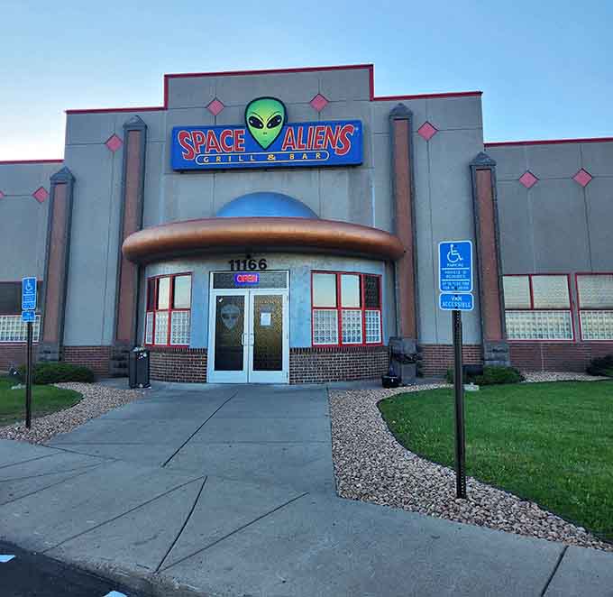 Space Aliens' retro-futuristic exterior looks like a UFO landed in Minnesota and decided to serve burgers instead of probing anyone.