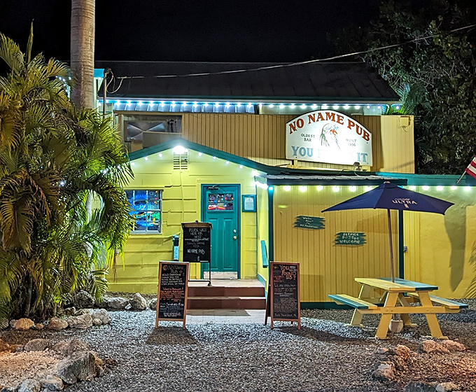 No Name Pub glows invitingly at night, its turquoise door and string lights creating a beacon for hungry travelers on Big Pine Key.