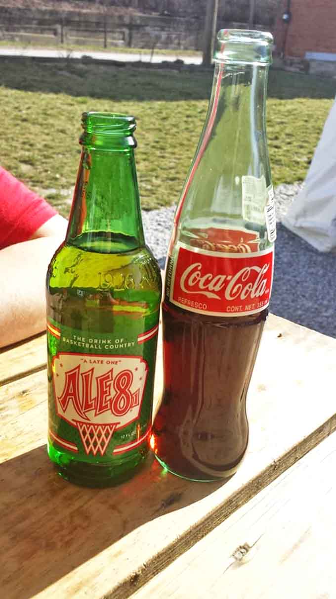 The perfect barbecue companions: an ice-cold Ale-8 (Kentucky's pride) and classic Coca-Cola in glass bottles &ndash; because nostalgia tastes delicious.