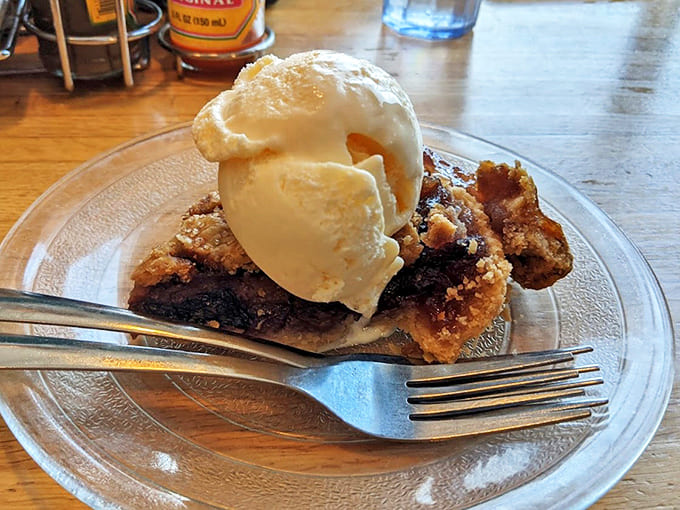 The "Banana Nut" creation features caramelized bananas and whipped cream atop a golden waffle, proving that breakfast and dessert aren't mutually exclusive.