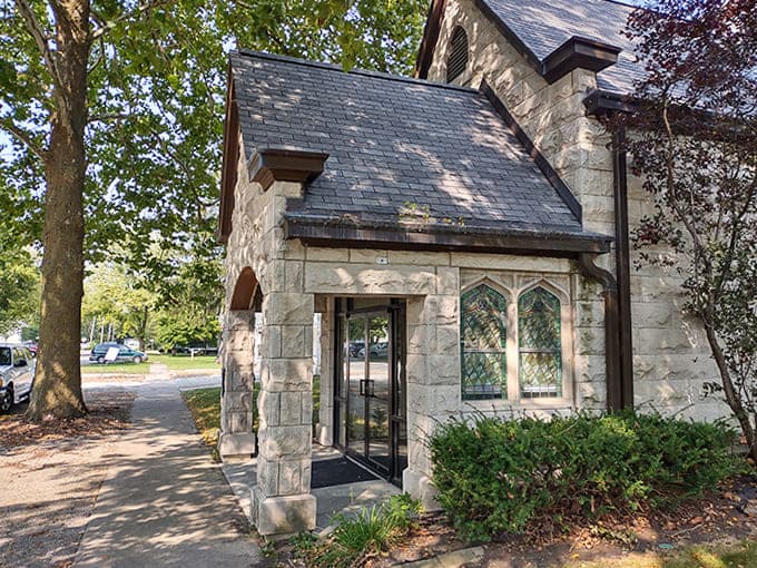 Stone archways and Gothic details on this building entrance prove that Arcola takes its architecture seriously, even when nobody's watching.