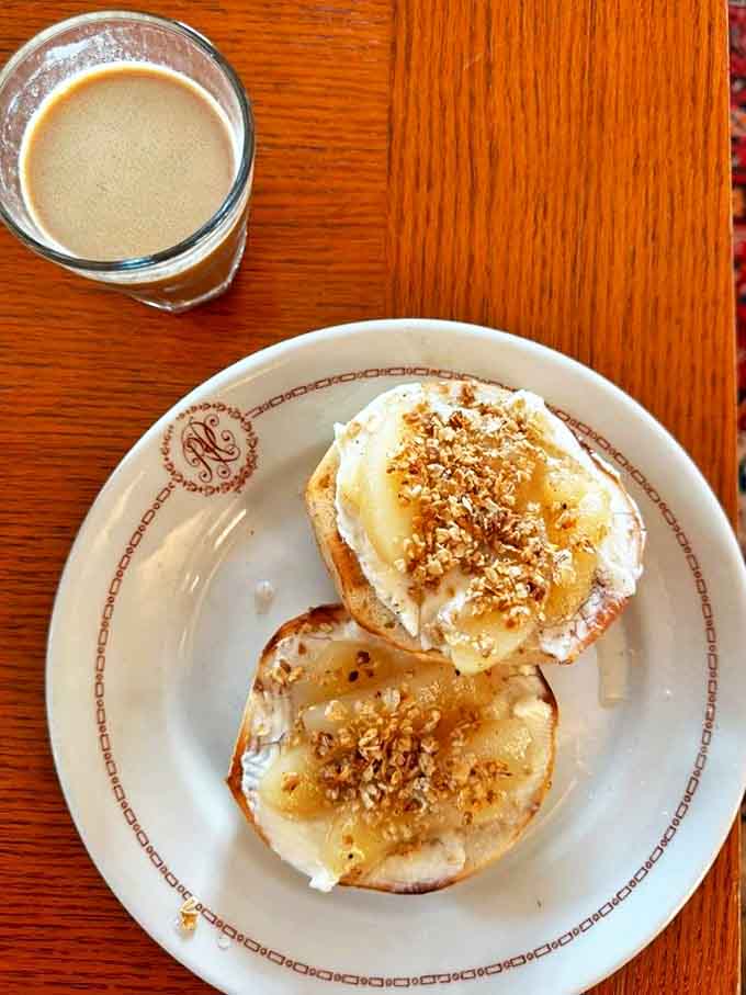 Cream cheese bagels topped with honey and granola create a sweet moment of bliss &ndash; simple ingredients transformed into something transcendent.