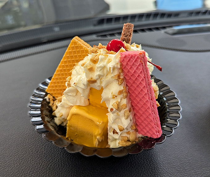 A mountain of ice cream flanked by colorful wafers – dessert architecture that would make Frank Lloyd Wright proud.