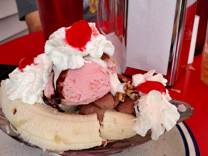 A monument to dessert excess, the banana split arrives with three ice cream scoops standing proud among rivers of toppings.