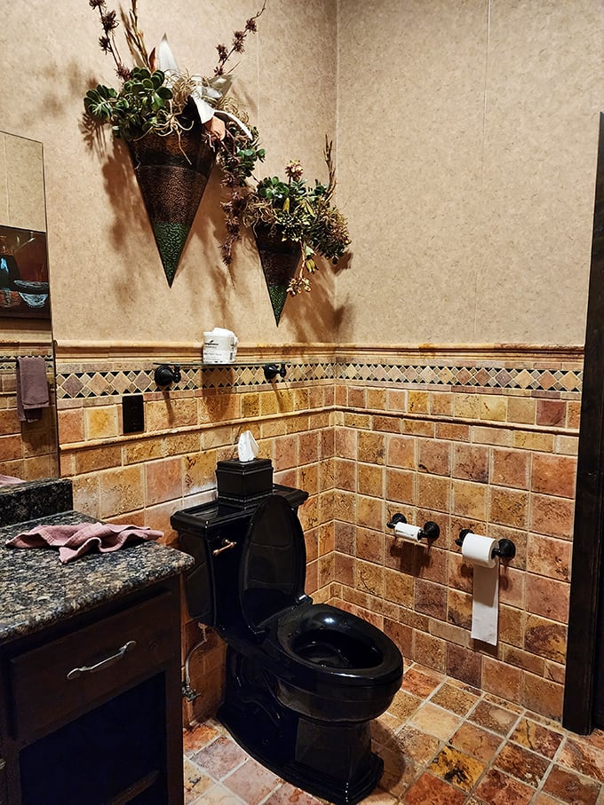 Even the bathrooms maintain the thematic integrity, with elegant tile work and decorative touches creating a cohesive experience.