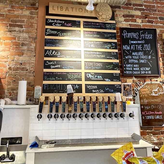 The craft beer selection flows from taps beneath a chalkboard menu, promising local Michigan brews alongside European favorites.