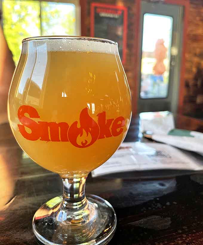 Smoke's signature glassware cradles liquid gold&mdash;a hazy craft beer whose citrus notes and gentle bitterness complement smoky meats perfectly.