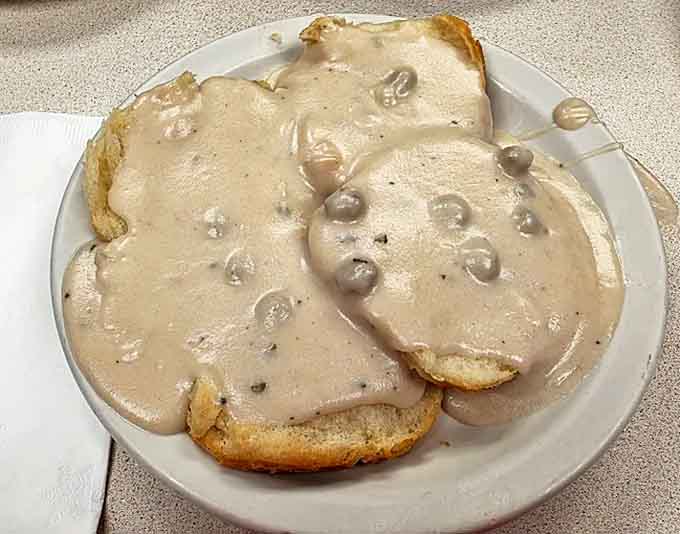 Biscuits and gravy that would make your grandmother jealous &ndash; pillowy biscuits smothered in rich, peppery gravy studded with sausage.