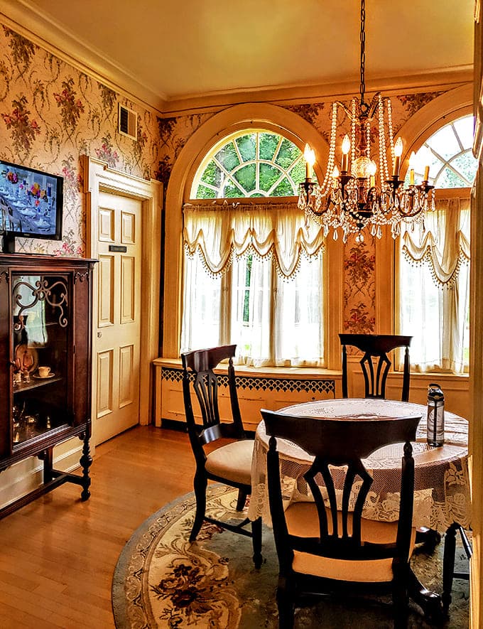 Breakfast Room: Morning coffee achieves new heights of elegance in this sun-drenched nook, where crystal chandeliers sparkle above intimate conversations.