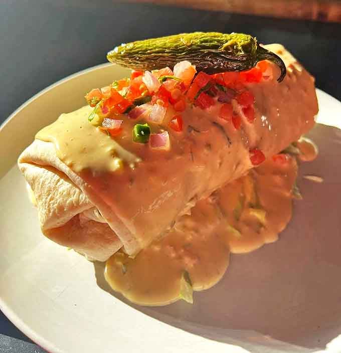 This breakfast burrito doesn't just start your day &ndash; it celebrates it with tender pork, eggs, and house-made queso topped with a roasted jalape&ntilde;o exclamation point.