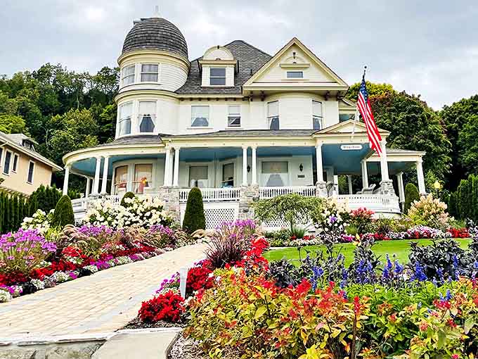 The Brigadoon cottage showcases Victorian architecture at its finest, surrounded by gardens so perfect they make your home landscaping efforts seem pitiful.