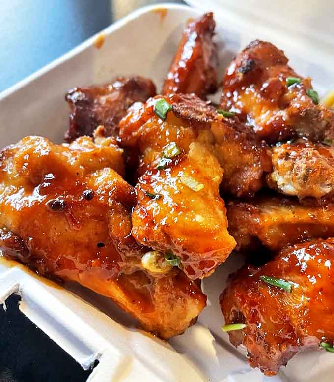 These aren't just wings &ndash; they're brick oven miracles with a glaze so good you'll be contemplating drinking it straight from the container.