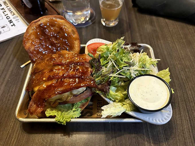 The Candied Bourbon Bacon Burger – a divine intervention in sandwich form that makes you close your eyes in silent reverence with each bite.